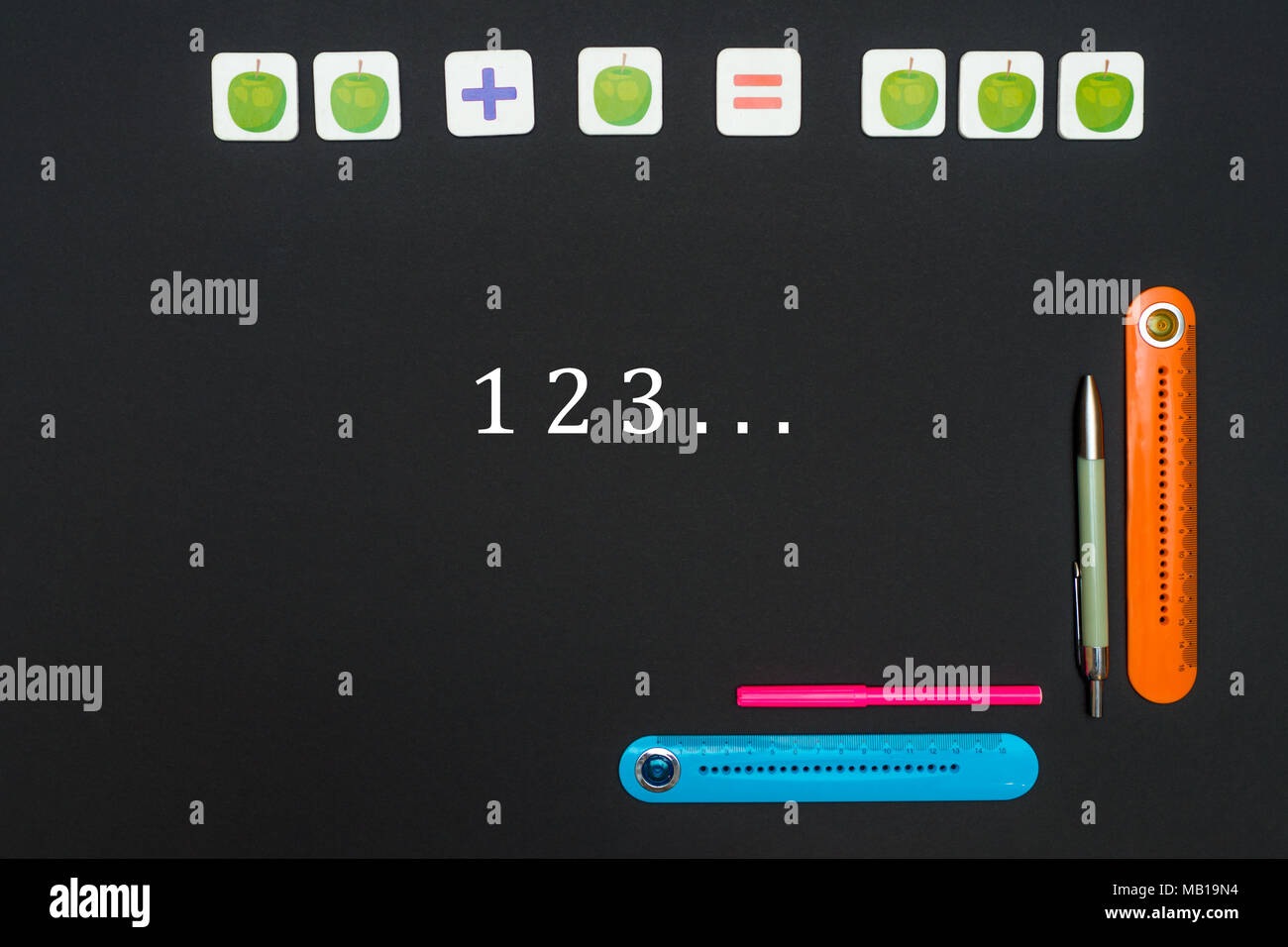 Concept school, black art table with stationery supplieswith numbers ...