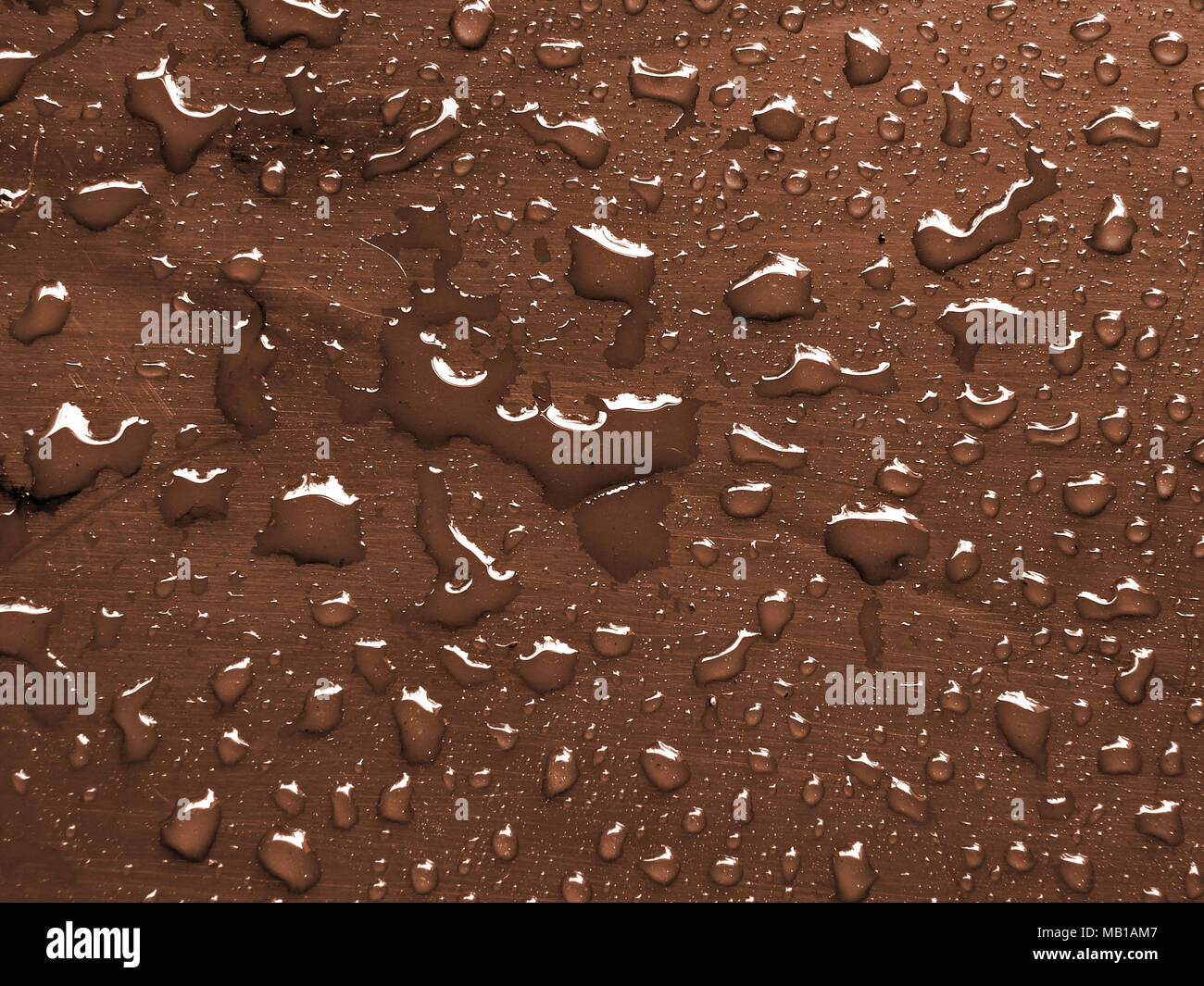 water drops on coconut brown metallic surface Stock Photo - Alamy