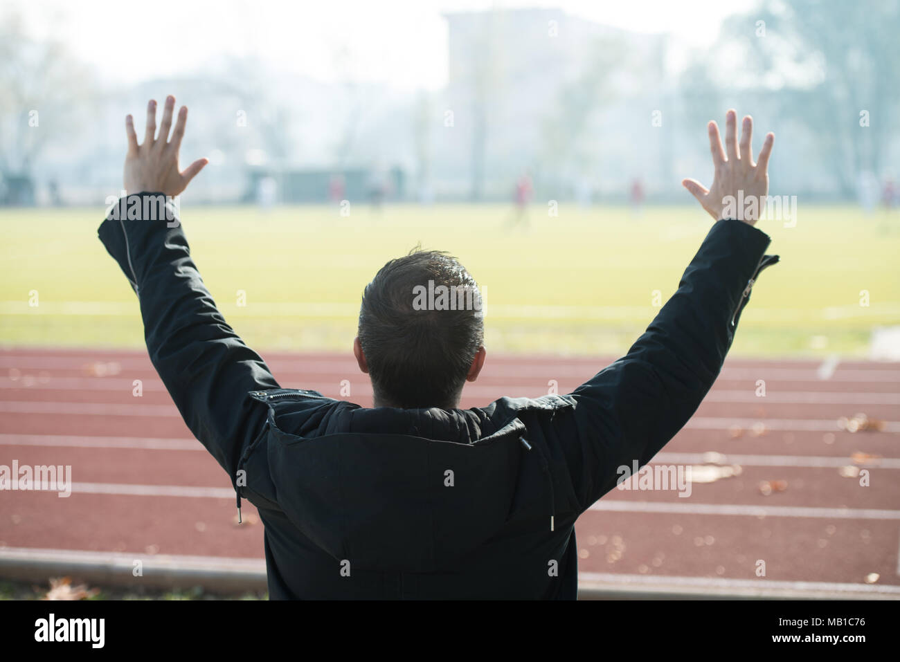 Back View of Young Man Sitting on Seat or Bleachers Sports Tribune and ...
