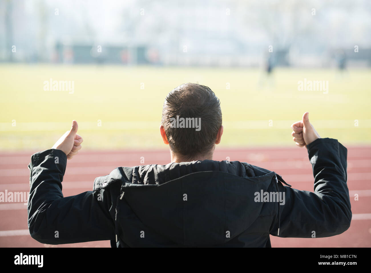Back view excitement hi-res stock photography and images - Alamy