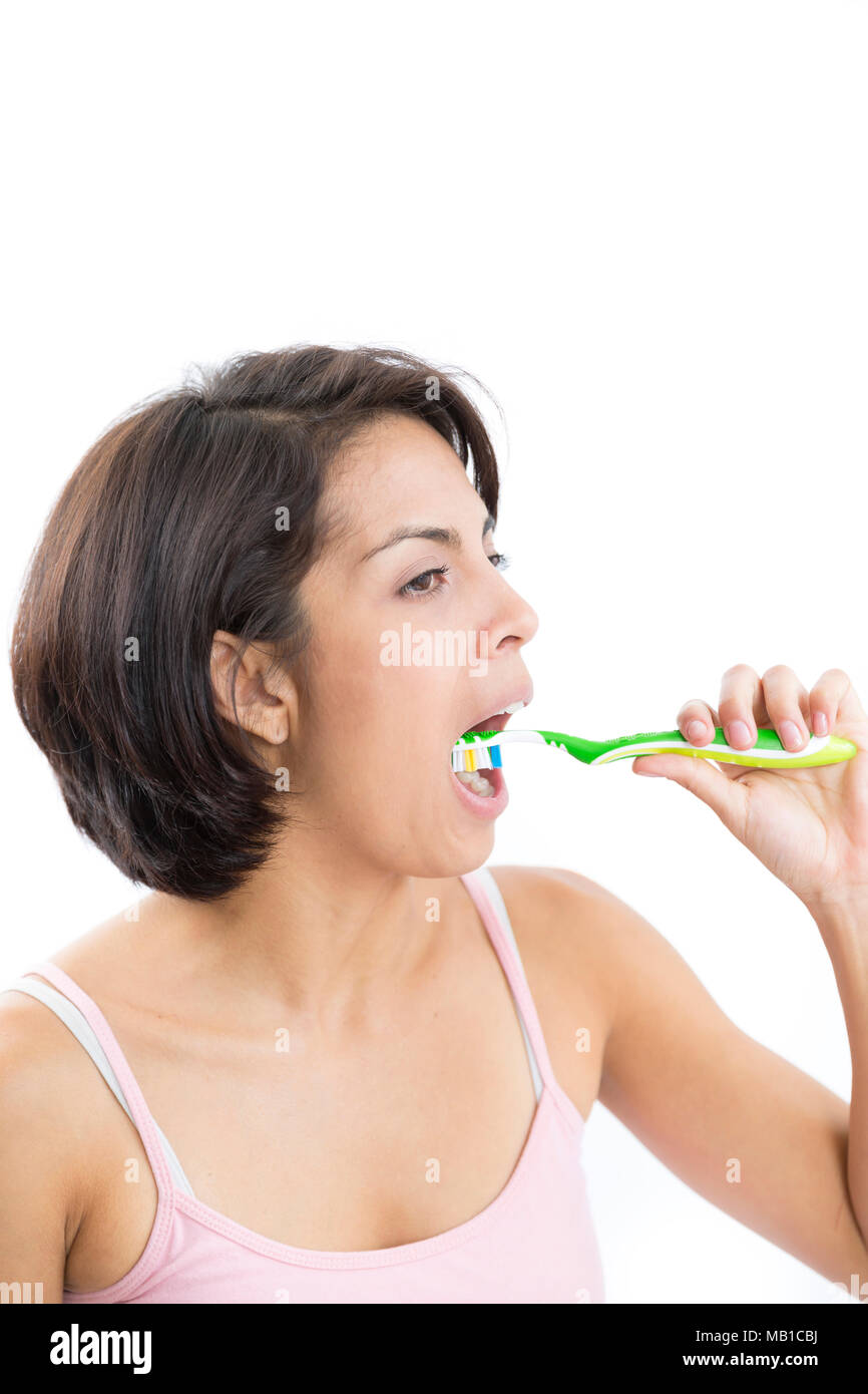 Portrait Of Attractive Woman Brushing Teeth In White Background Stock ...