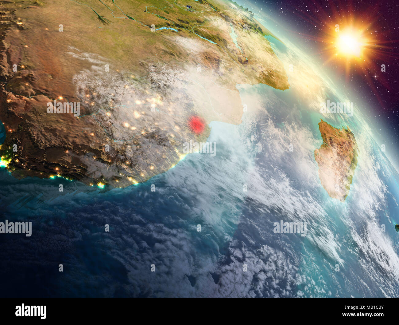 Sunrise above Swaziland highlighted in red on model of planet Earth in space. 3D illustration ...
