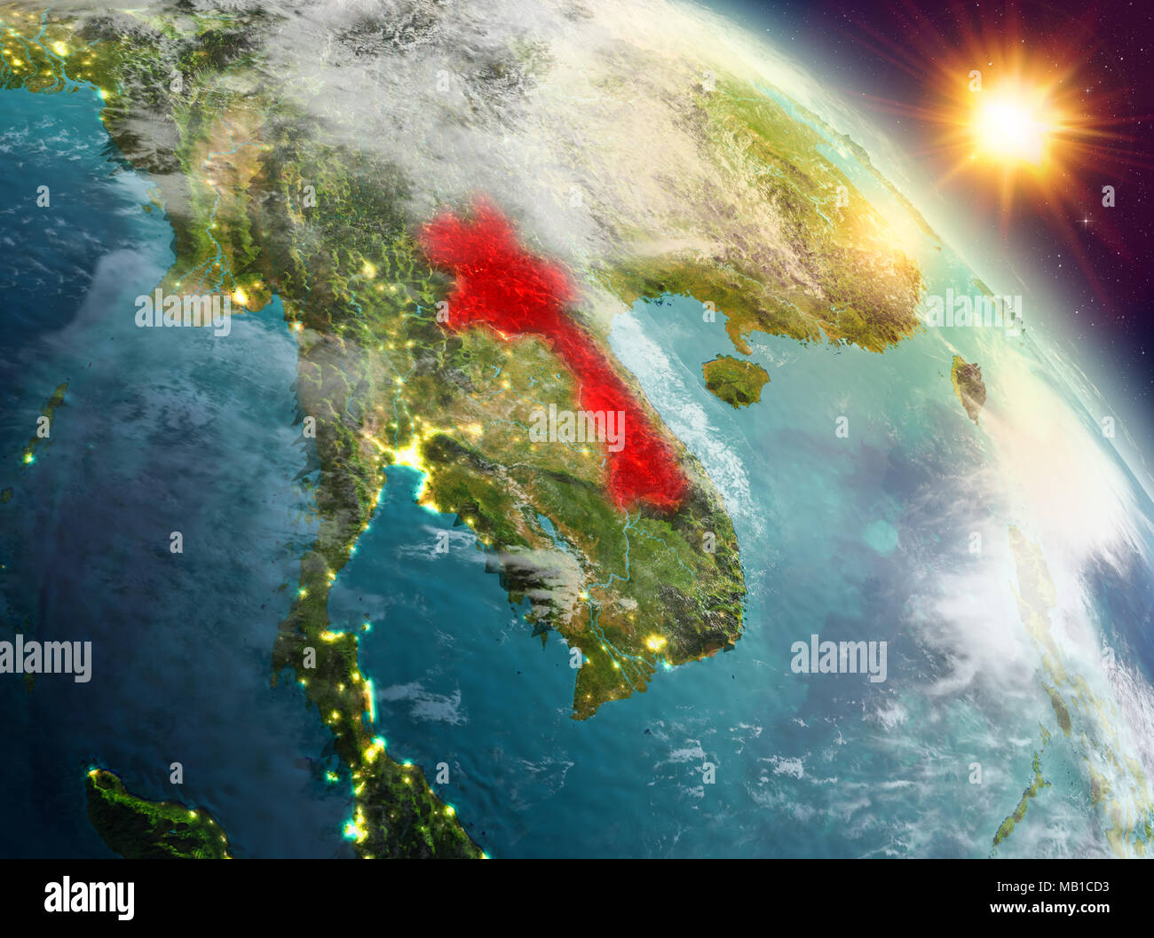 Sunrise above Laos highlighted in red on model of planet Earth in space ...