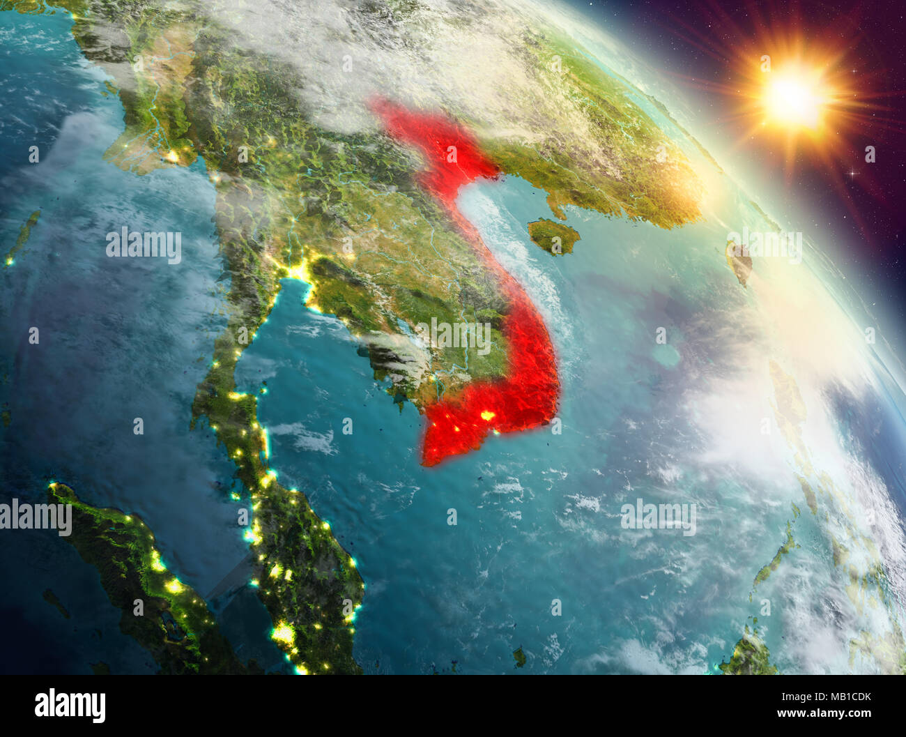 Sunrise above Vietnam highlighted in red on model of planet Earth in ...