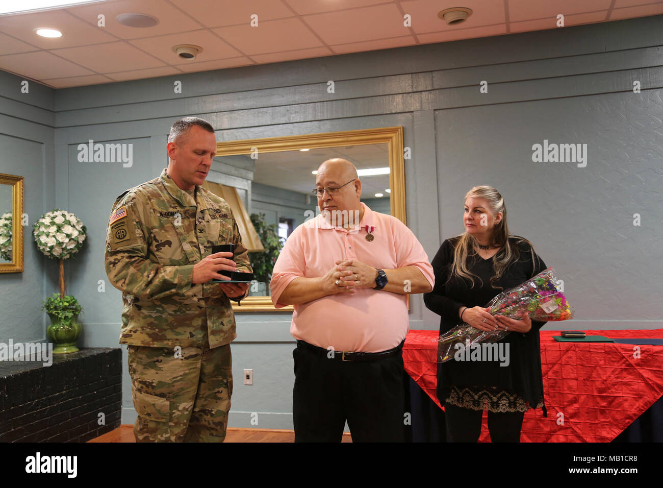 Col. McDonald presents Oscar Sanchez and his wife the symbolic Gold ...