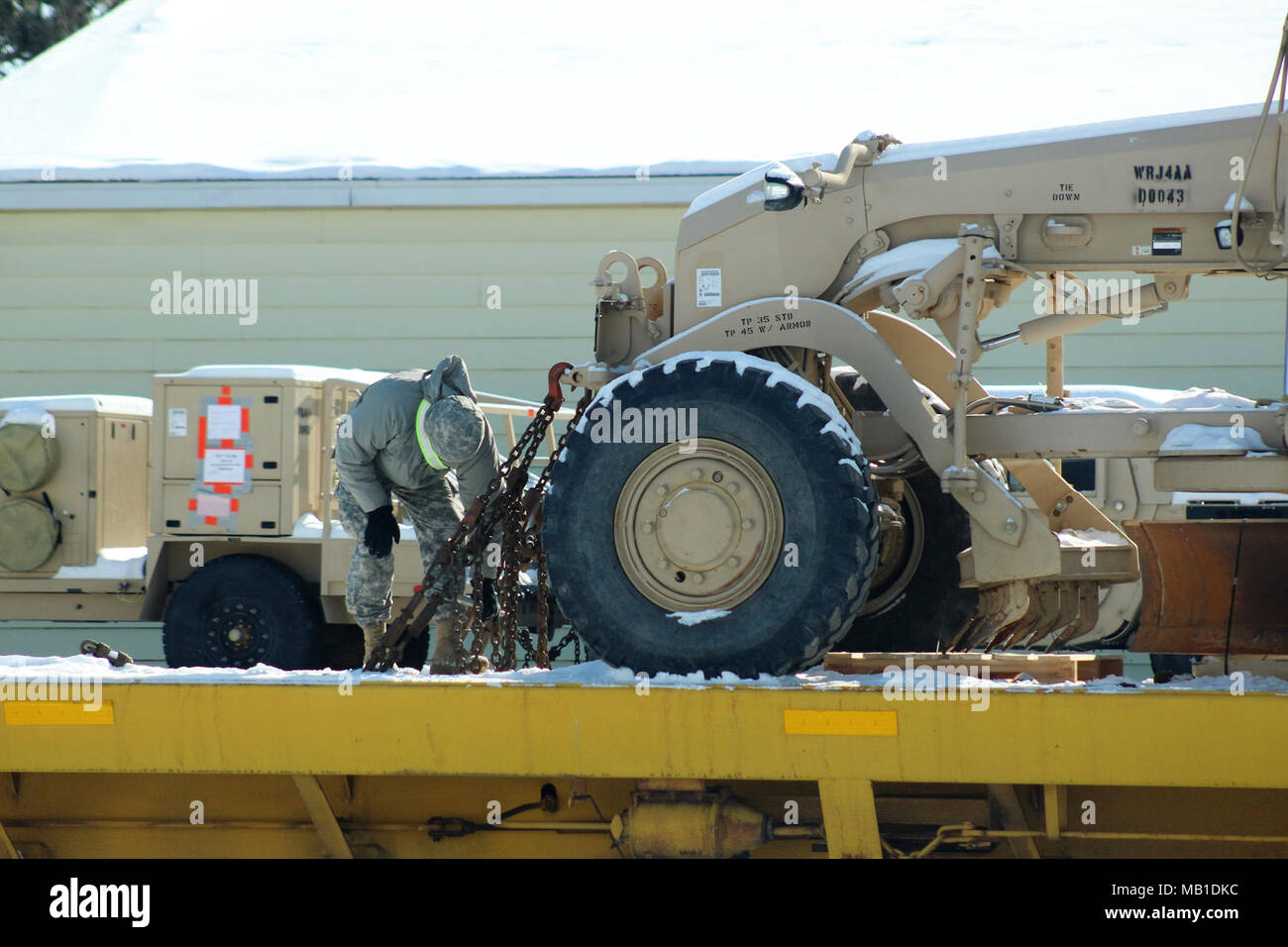 A Soldier prepares military equipment on railcars for shipment Feb. 7 ...