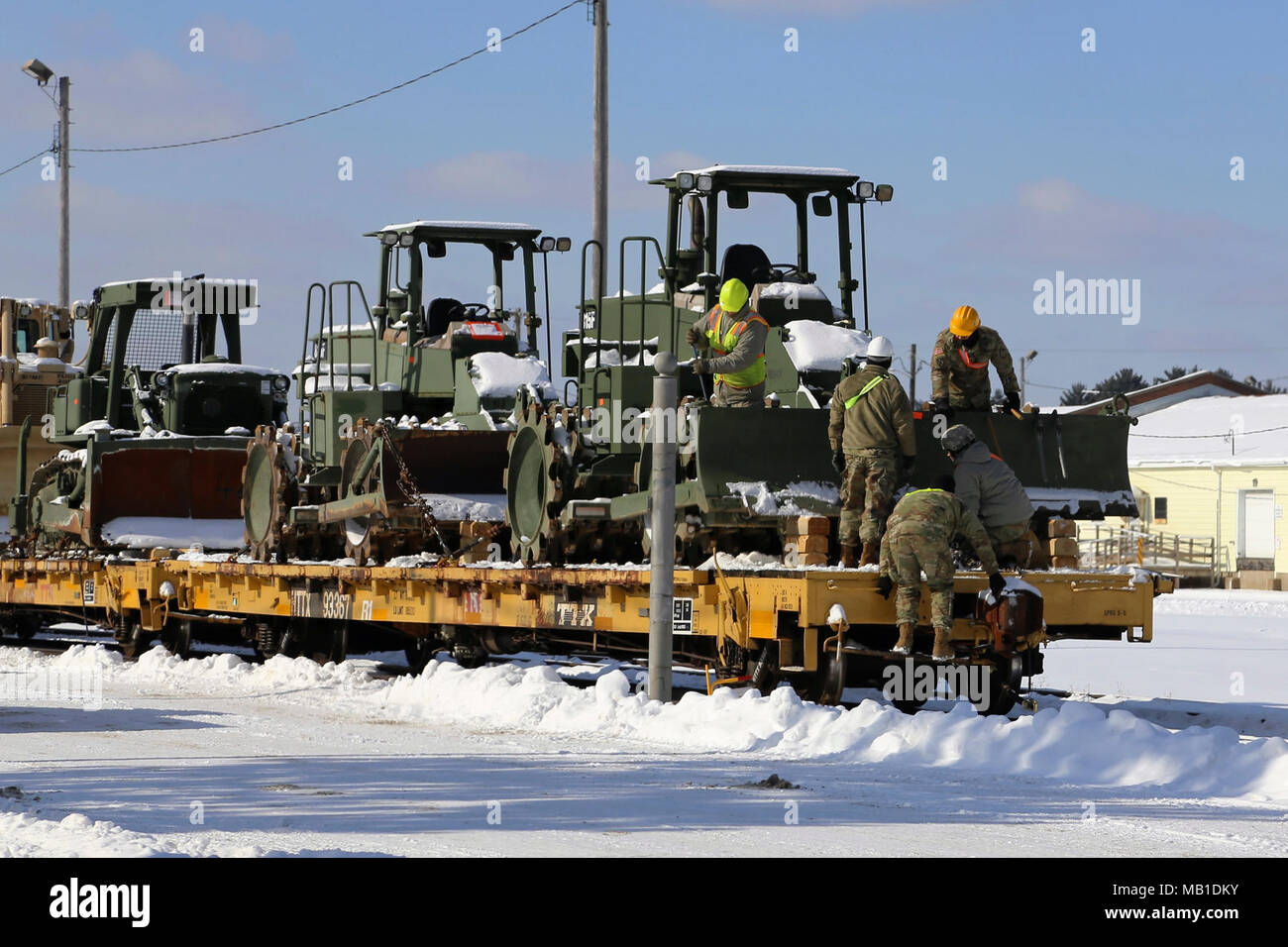 Soldiers prepare military equipment on railcars for shipment Feb. 7 ...