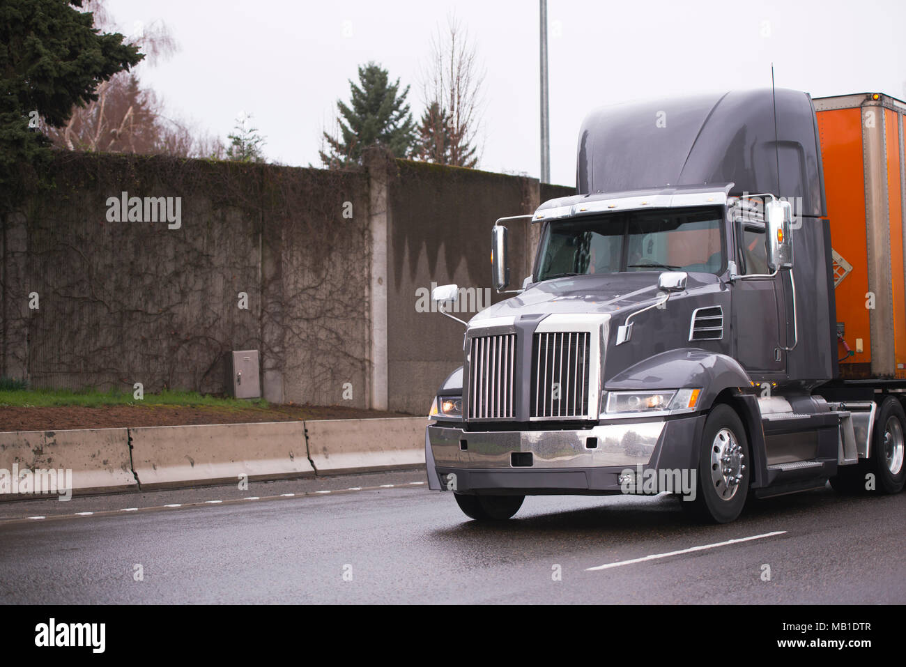 Gray modern stylish big rig day cab semi truck with orange dry van semi ...