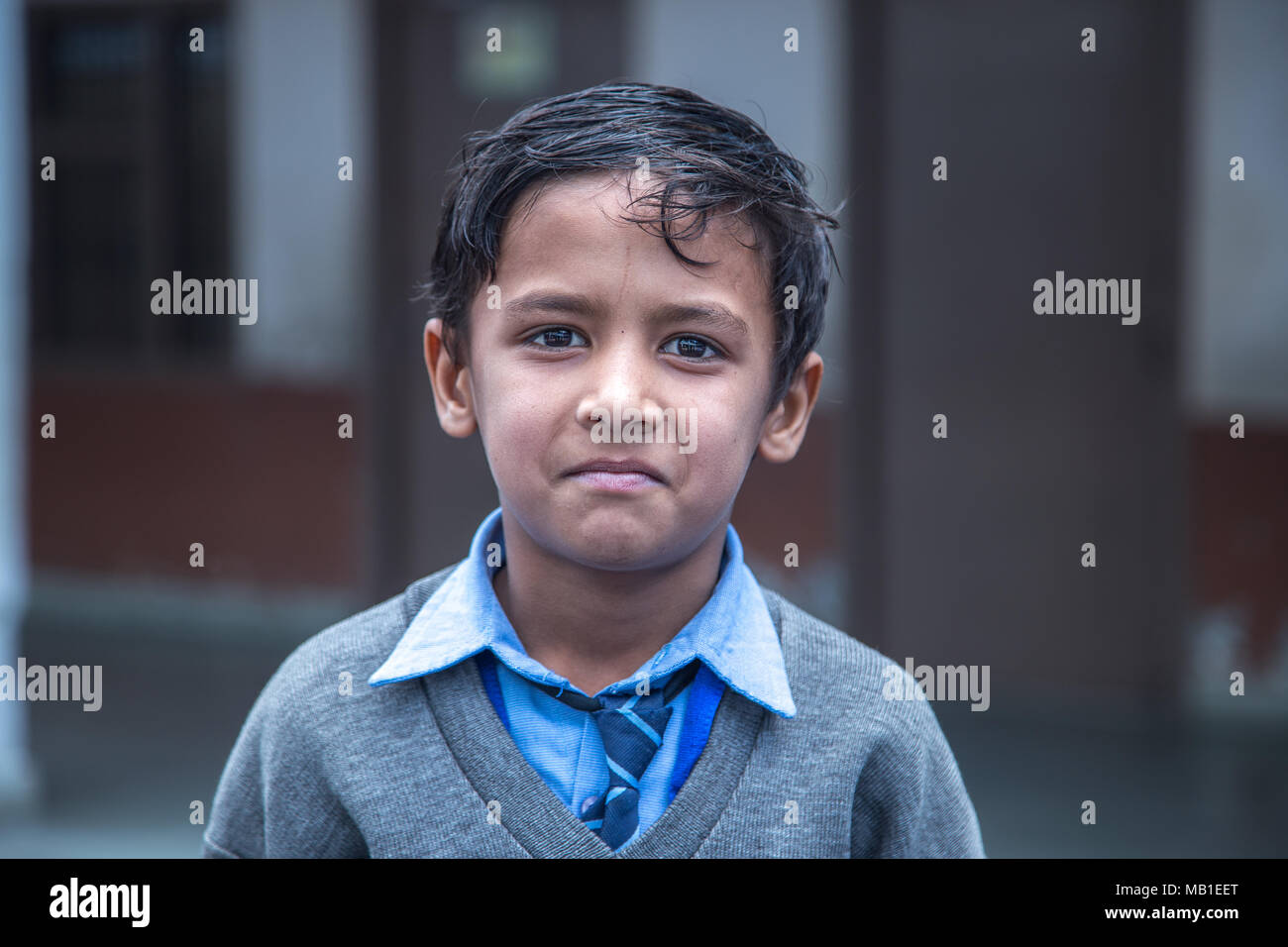 Closeup portrait of smiling 6-7 years Indian kid, standing straight at ...