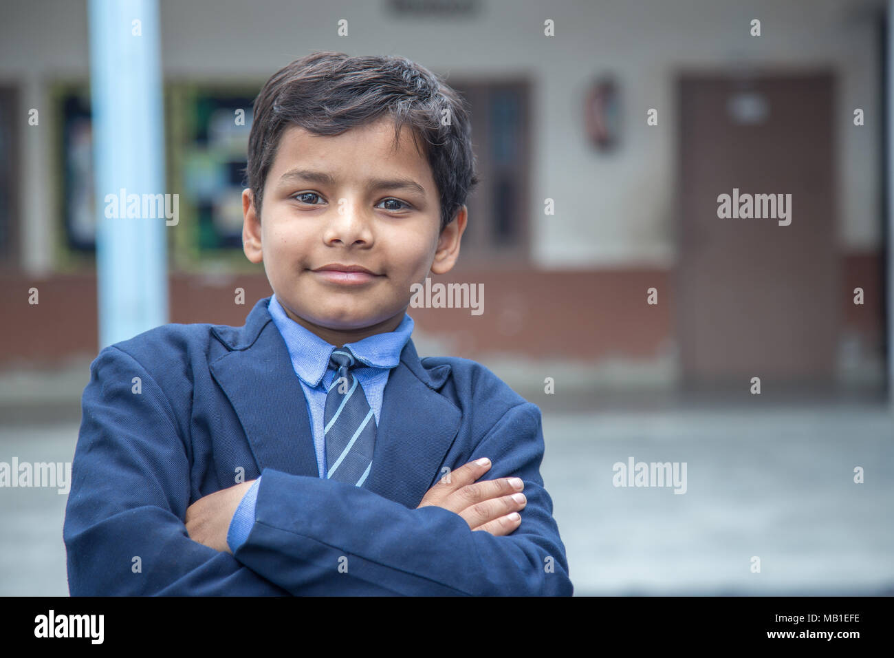 Closeup portrait of smiling 6-7 years Indian kid, standing straight at ...