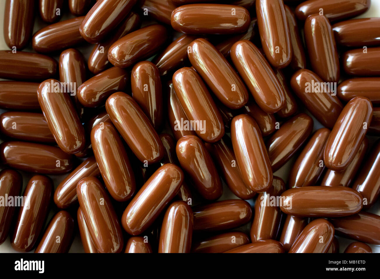 brown vitamin pills Stock Photo - Alamy