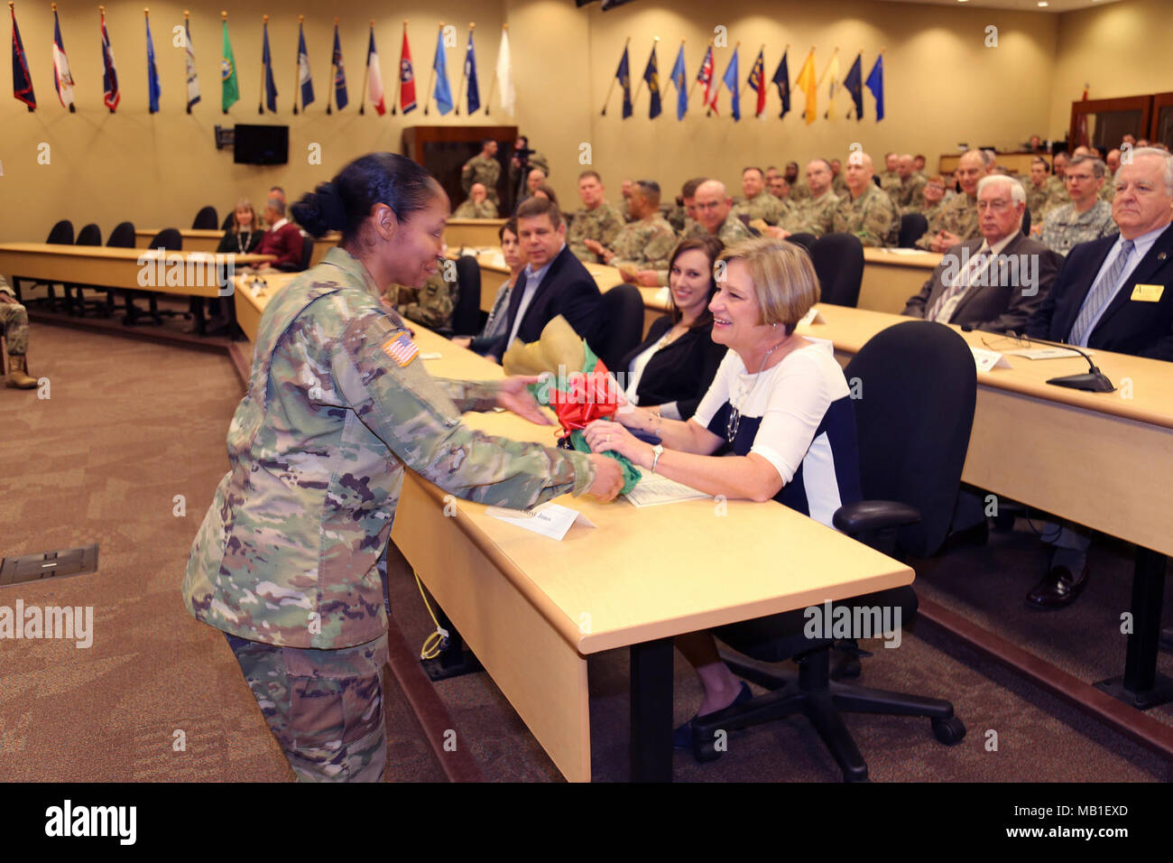 Flowers are presented to Maj. Gen. Jones' wife, Cheryl, during the 81st ...