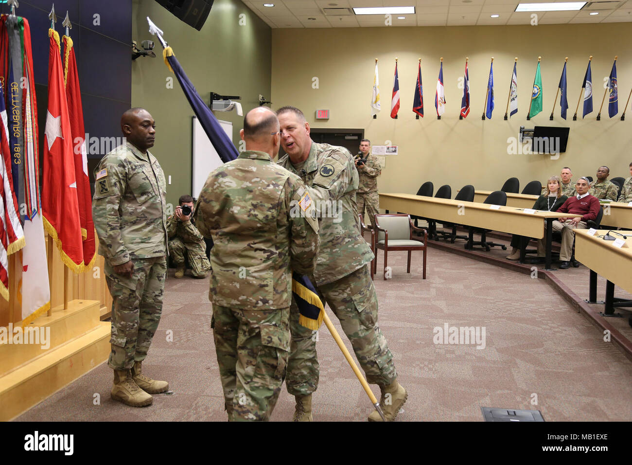 Maj. Gen. Kenneth Jones receives the flag from Maj. Gen. Scottie ...