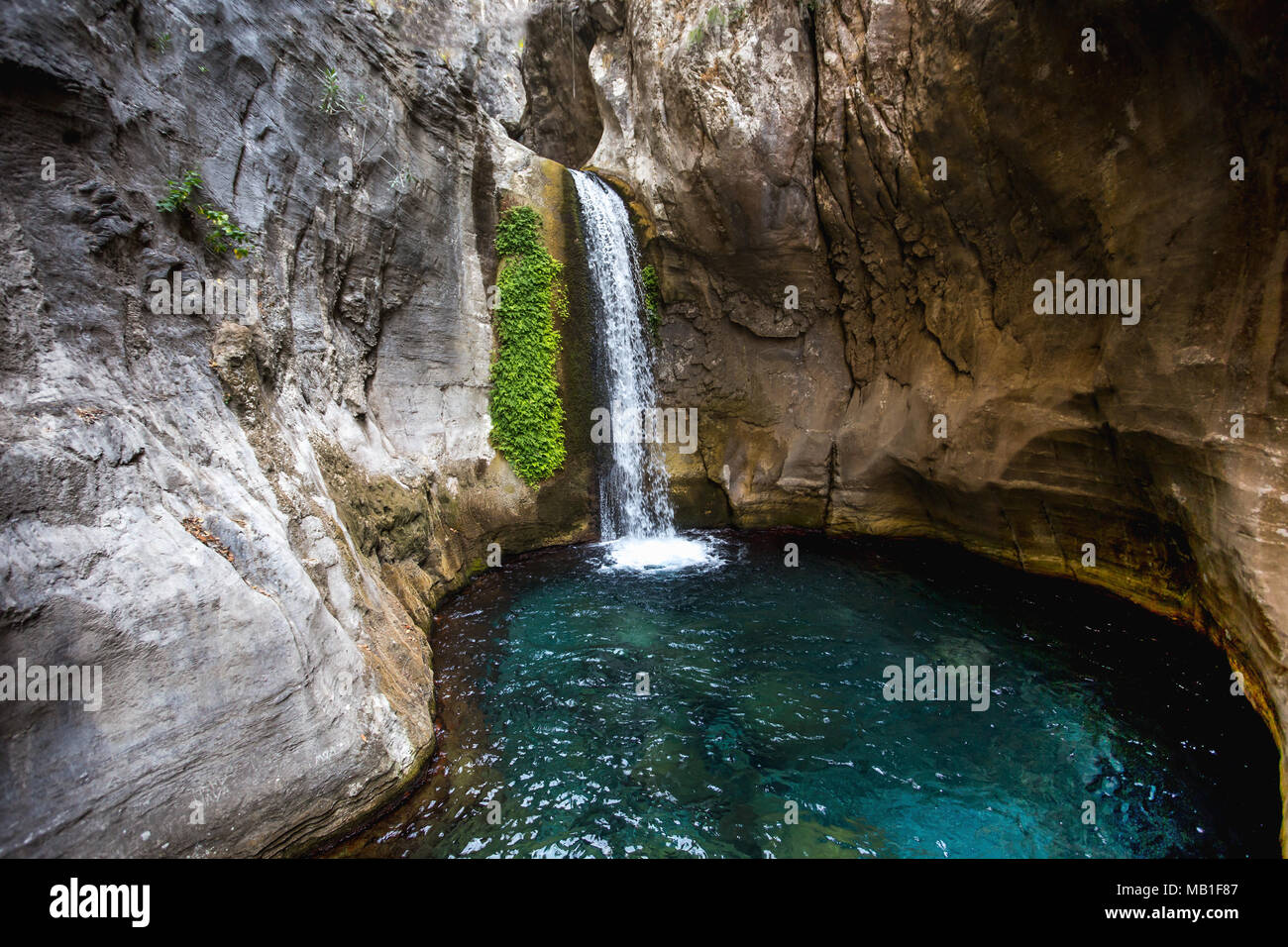 Travel and sighseeing concept. Beautiful waterfall and natural pool ...