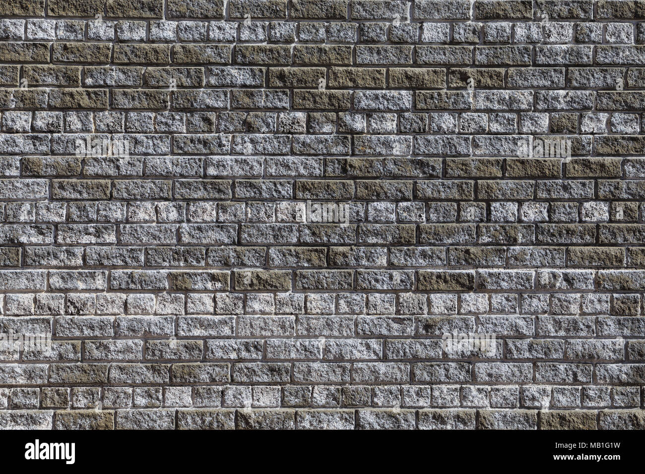 Brick wall made of grey and dirty white bricks. Full size front view ...