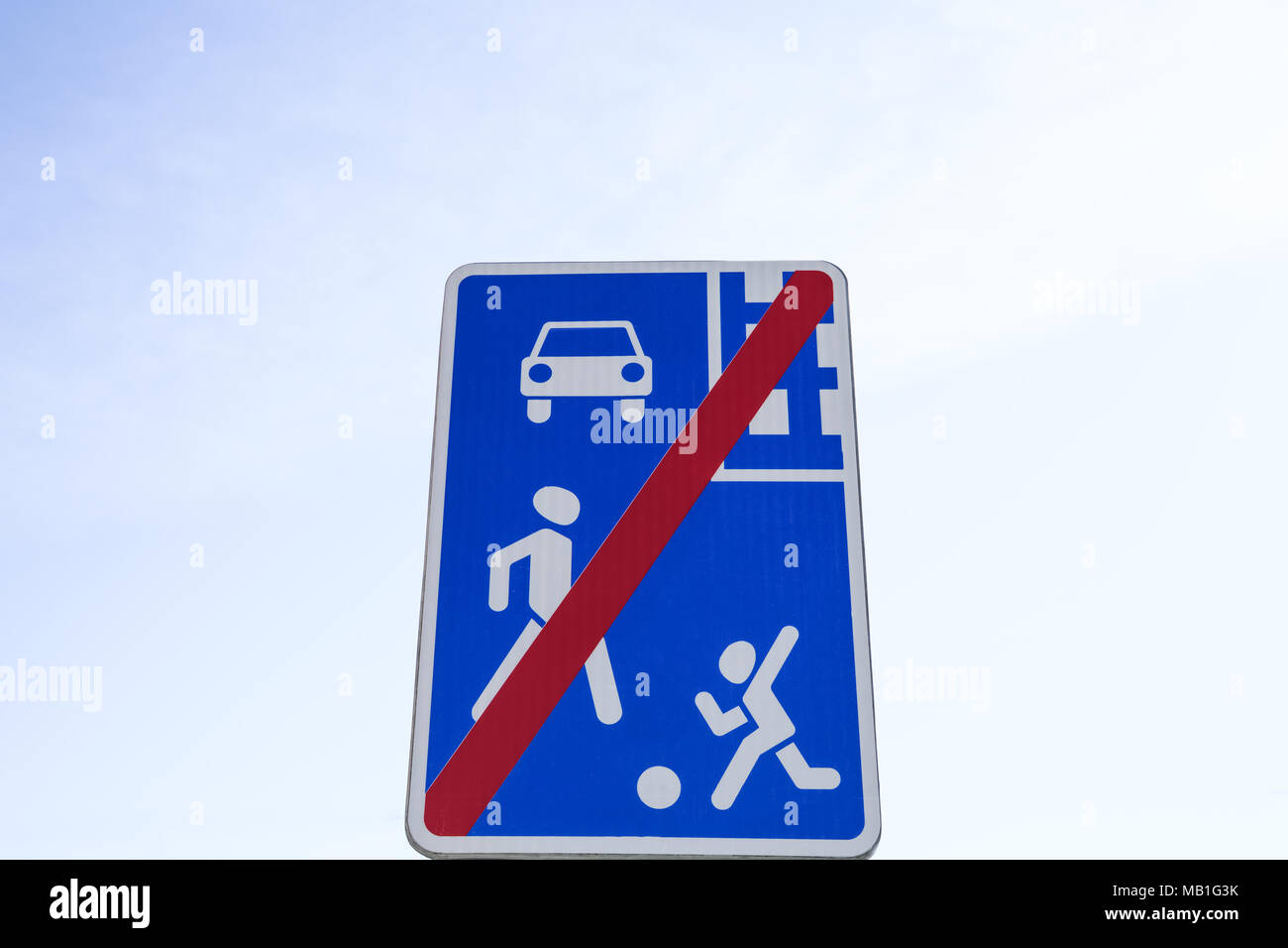 Traffic sign showing a car, a child and an adult crossed with red line ...