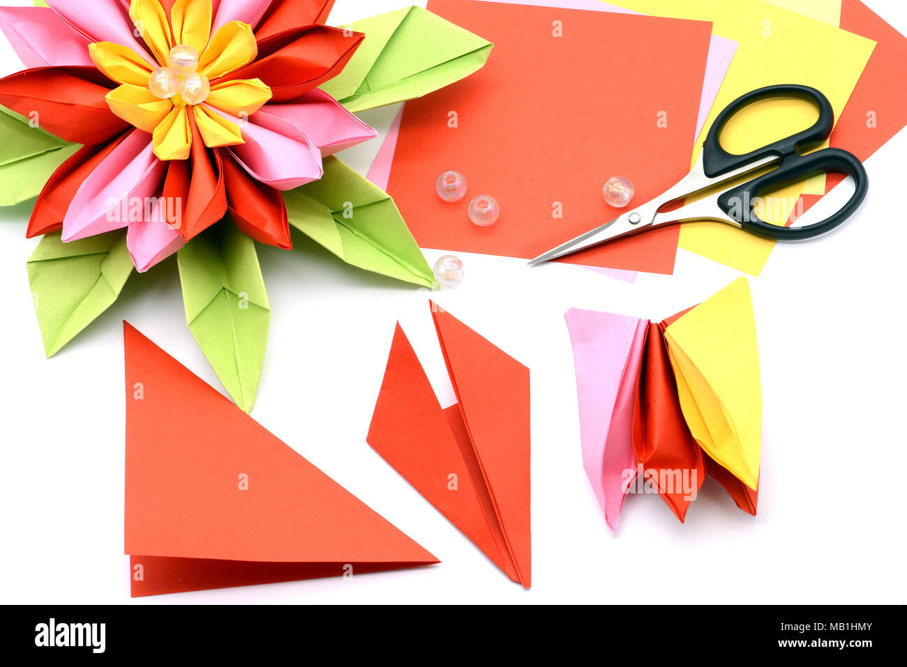 tinker a colorful paper water lily. origami on white isolated ...