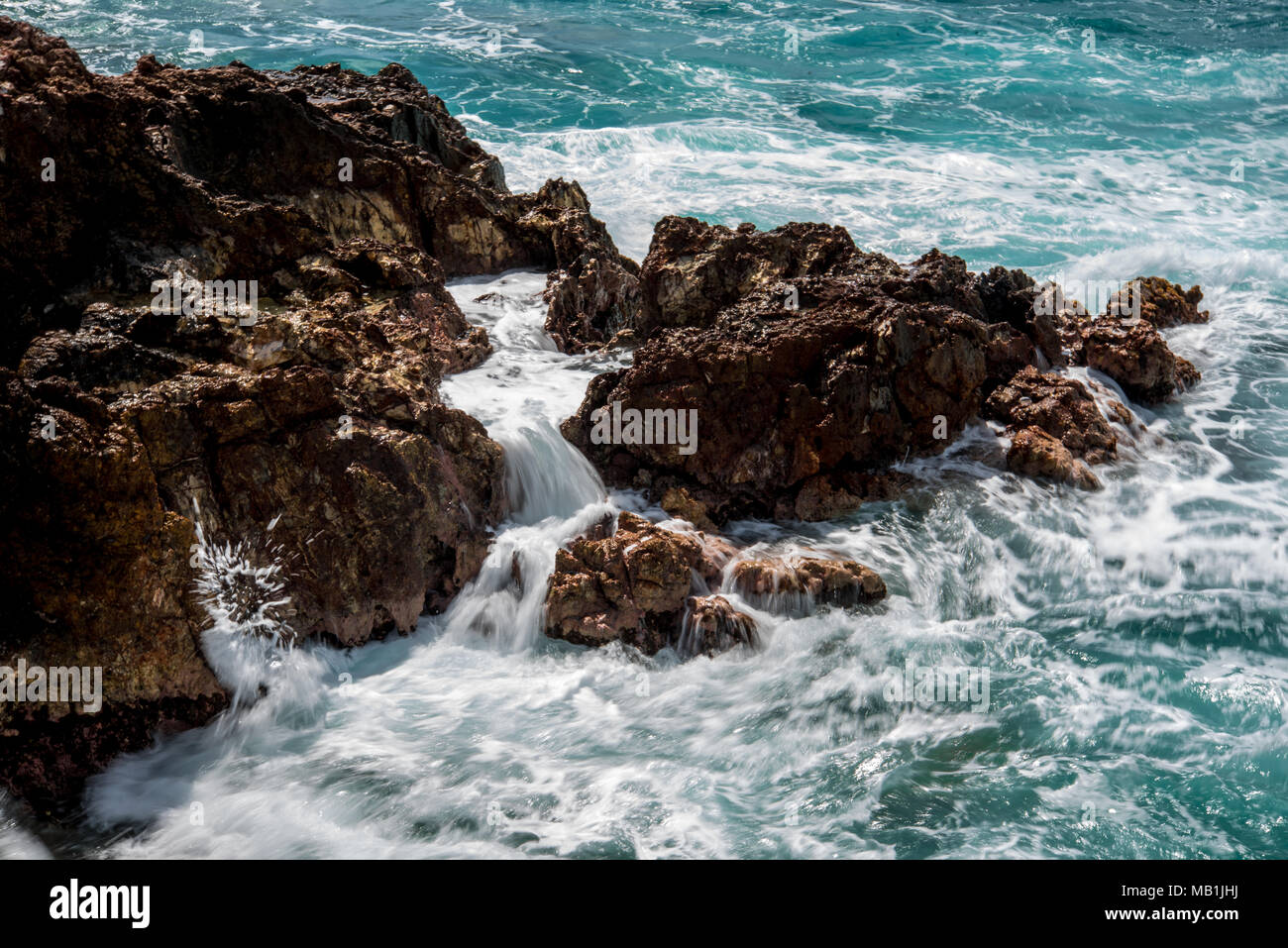 Ocean Waves Crash on Rocks Stock Photo - Alamy