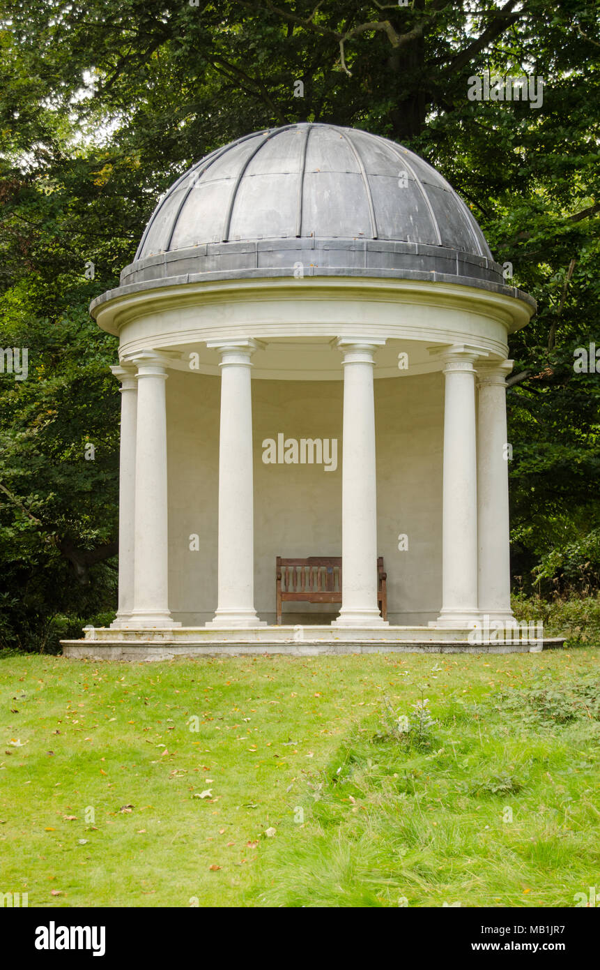 The historic Rotunda with doric columns and a garden bench set in the ...