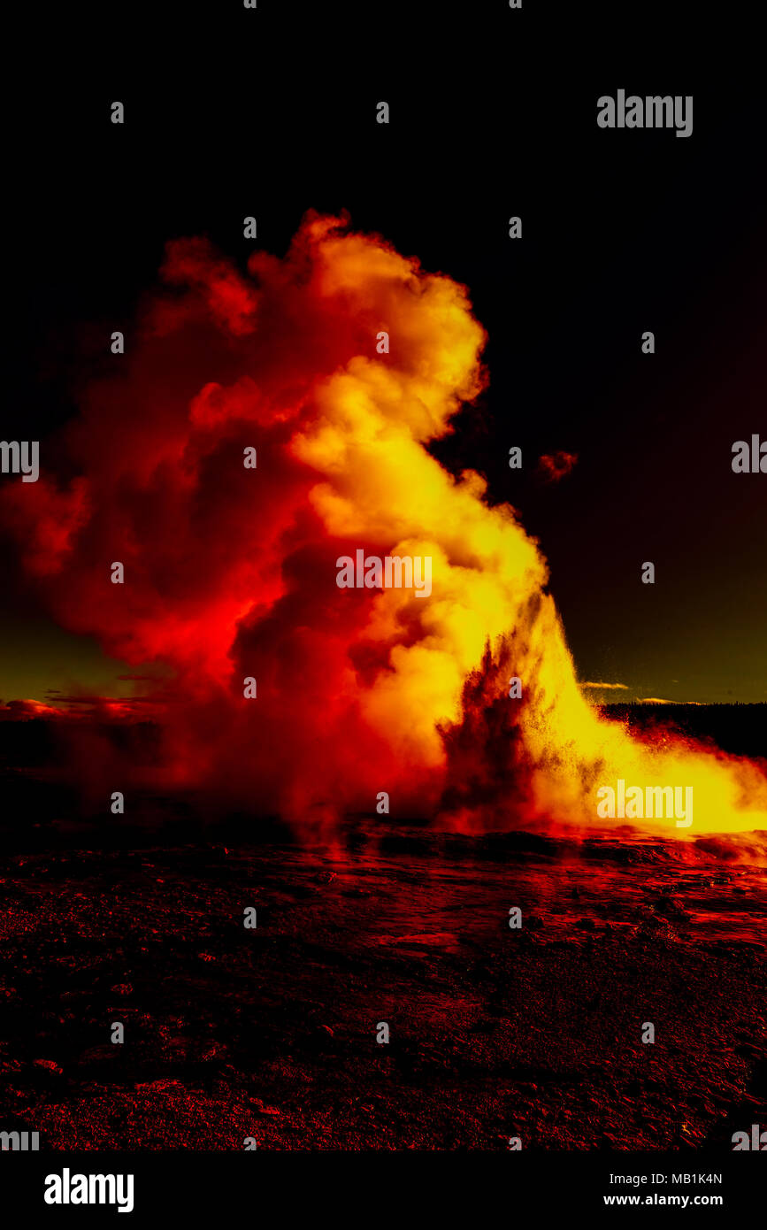 Red and orange steam geyser erupting against black sky Stock Photo - Alamy