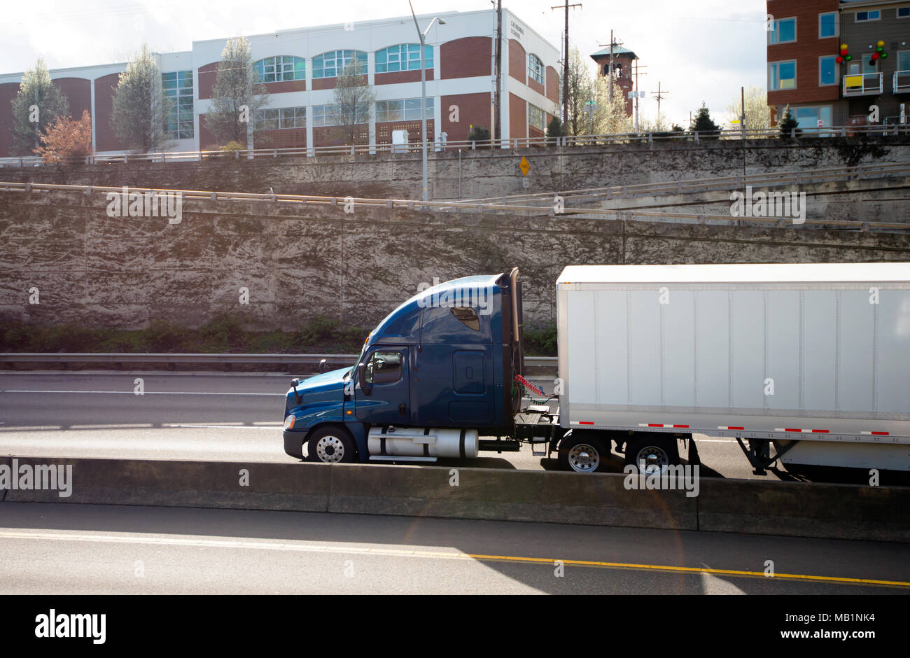 Modern big rig dark blue semi truck with high comfortable cab ...