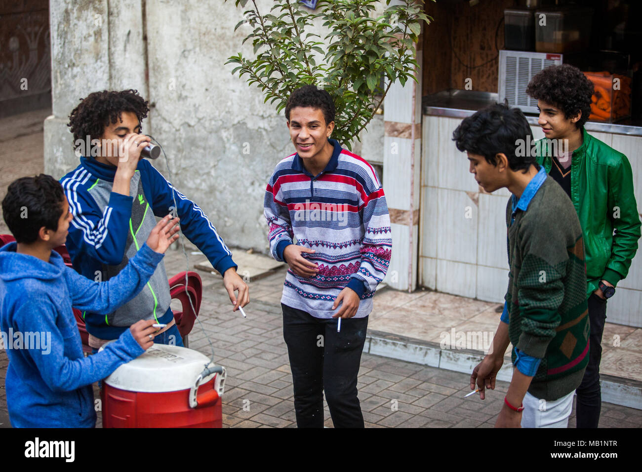 Teen boy smoking cigarette hi-res stock photography and images - Alamy