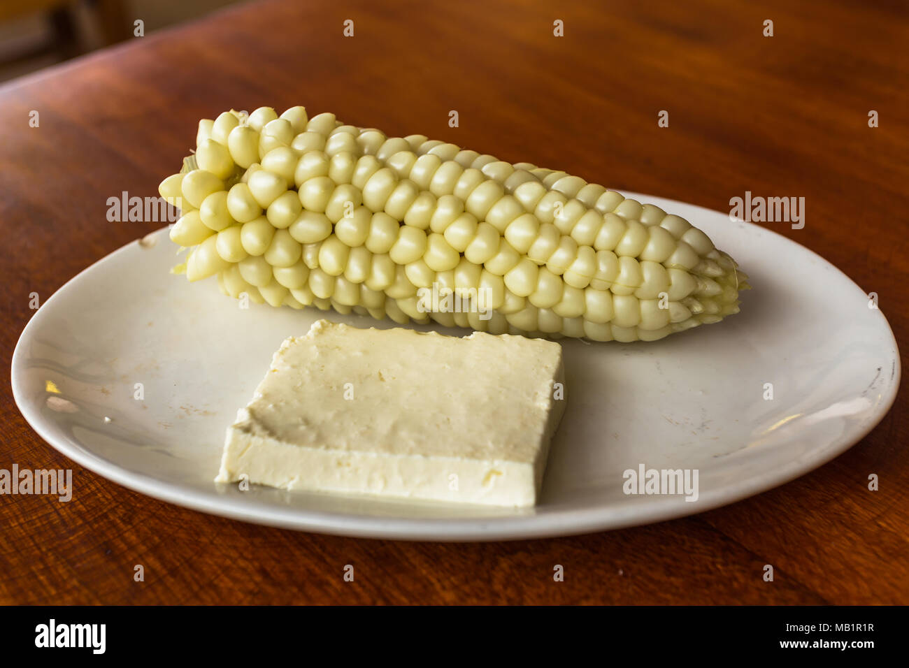 Choclo or tender corn cooked with cheese, traditional Ecuadorian food ...