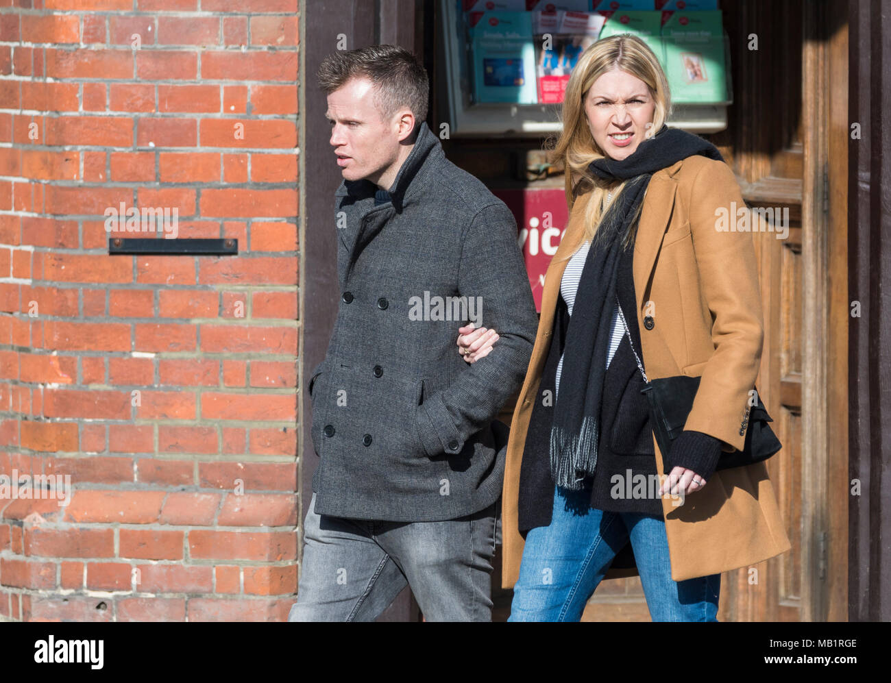 Young couple walking in town with linked arms in the UK Stock Photo - Alamy