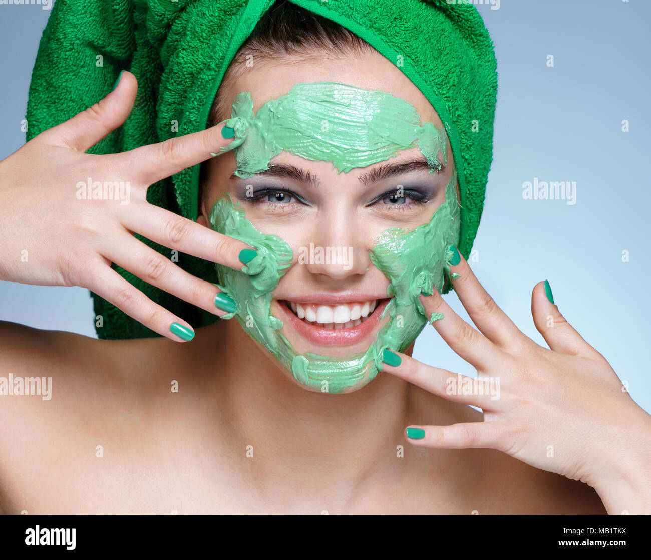 Smiling young woman green facial mask hi-res stock photography and ...