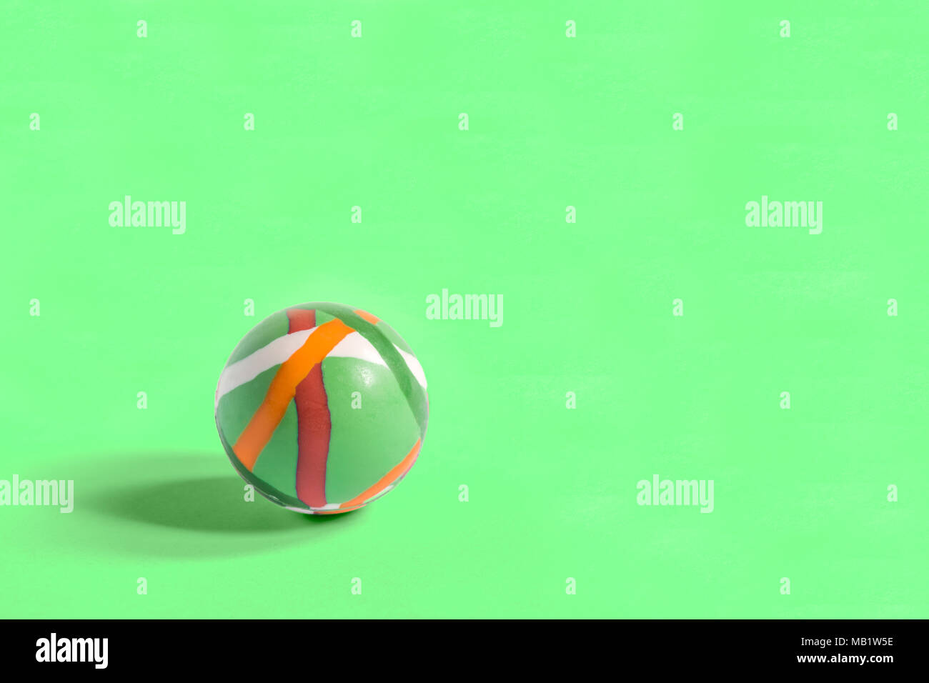 Green magic ball on a green background Stock Photo - Alamy