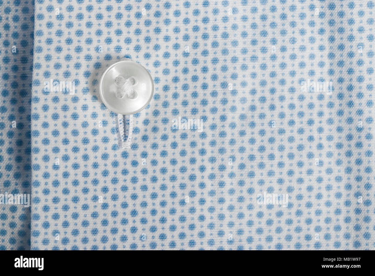Button of a shirt Stock Photo - Alamy