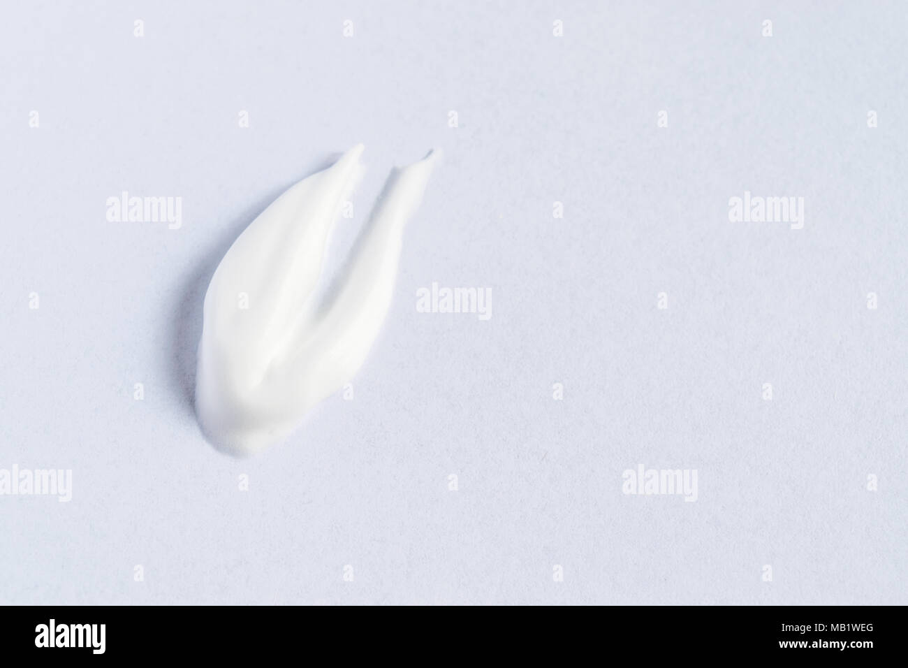 Cream spread on white surface Stock Photo - Alamy
