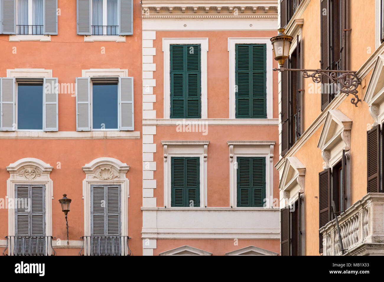 Windows and shutters on the colourful buildings in Piazza di Spagna ...