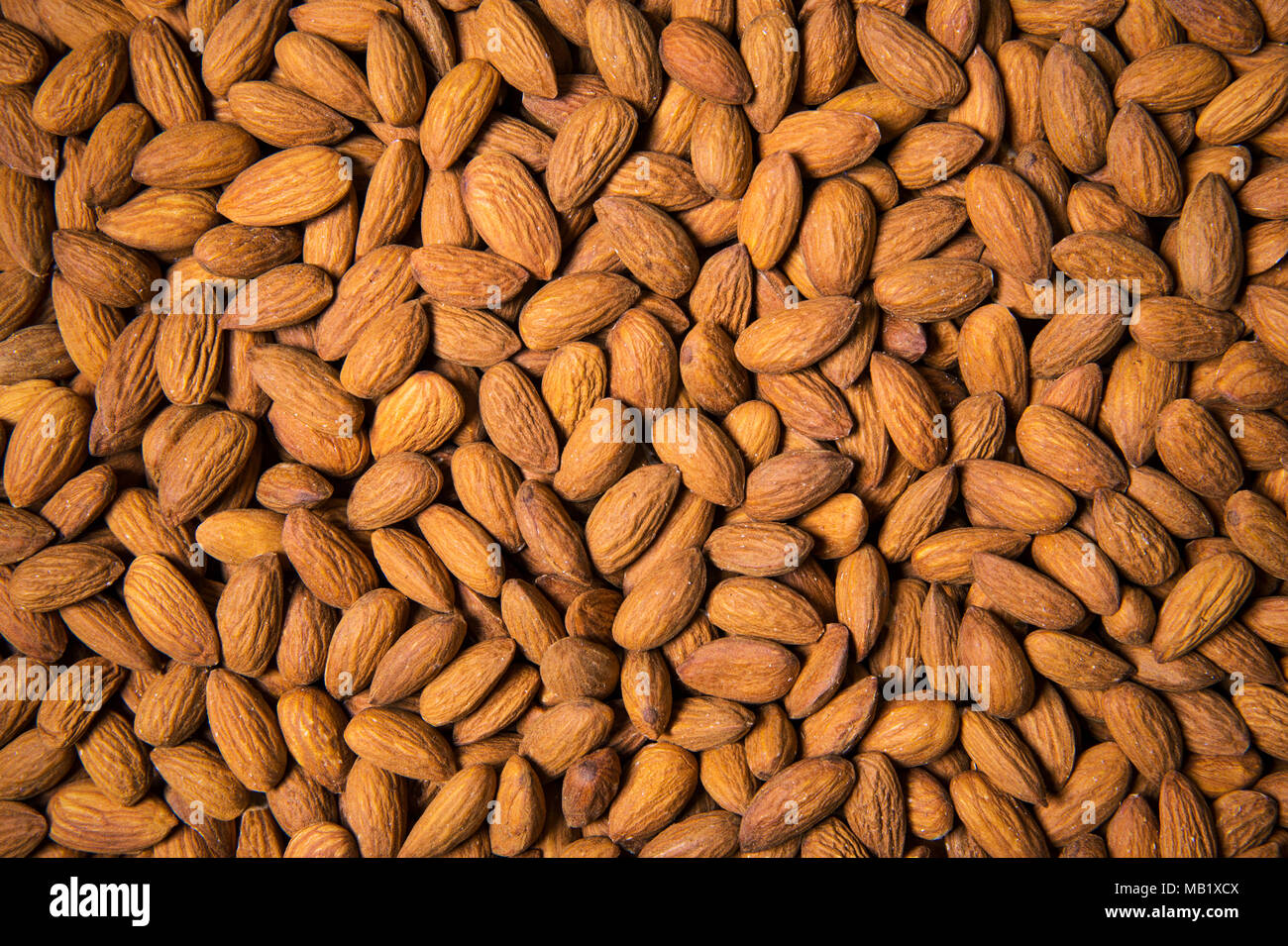 Almond seeds as food background Stock Photo - Alamy