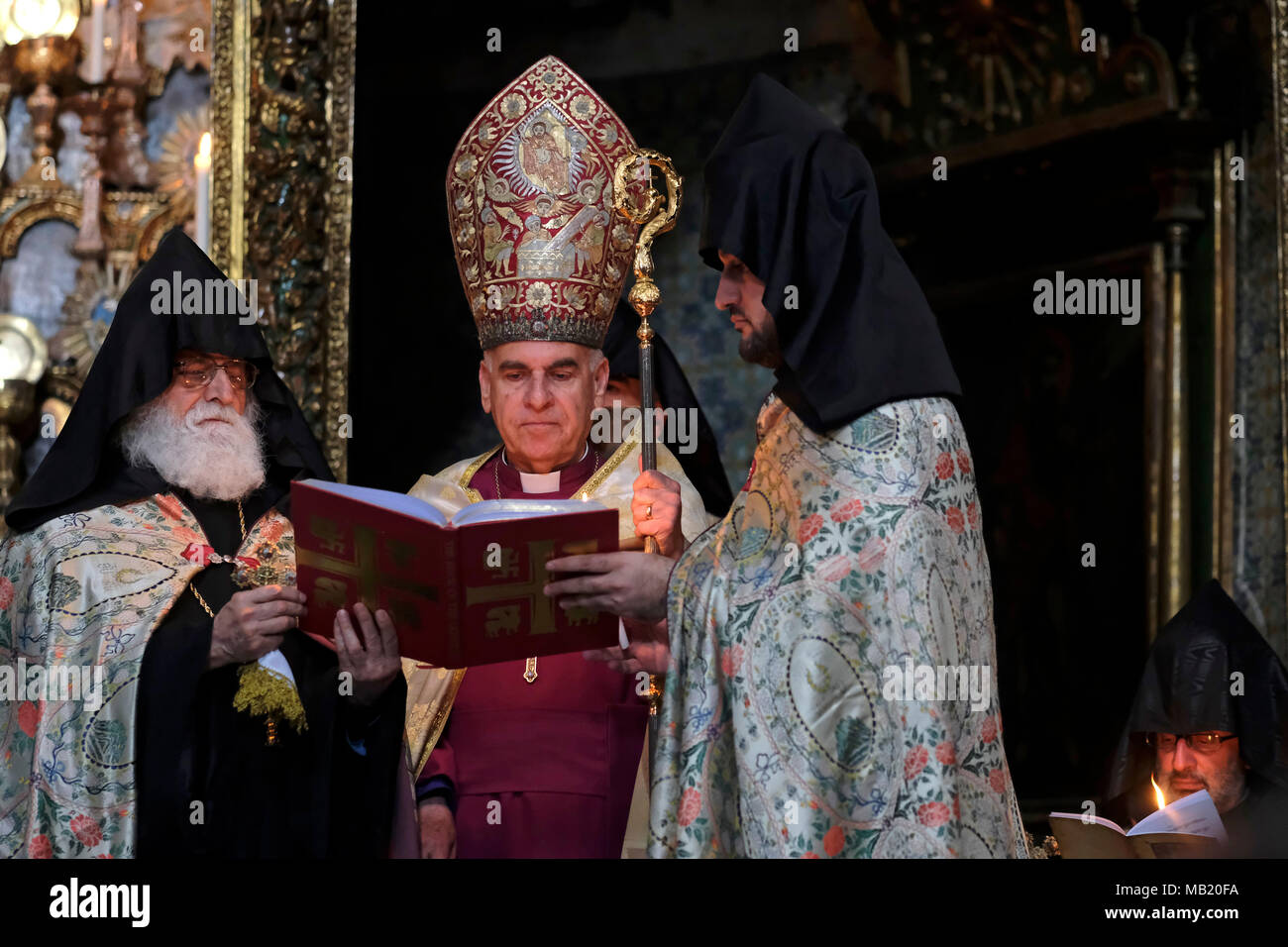 Jerusalem, Israel, 5th April 2018. Armenian priests holding the bible ...
