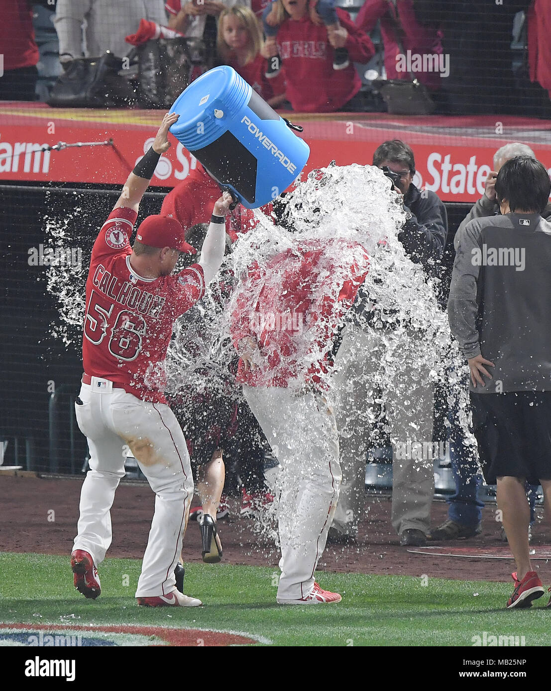 Kole Calhoun #56 of the Los Angeles Angels pours a bucket of ice water ...