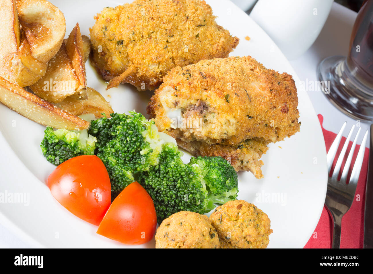An English pub/restaurant dish of Golden fried breaded Chicken thighs ...