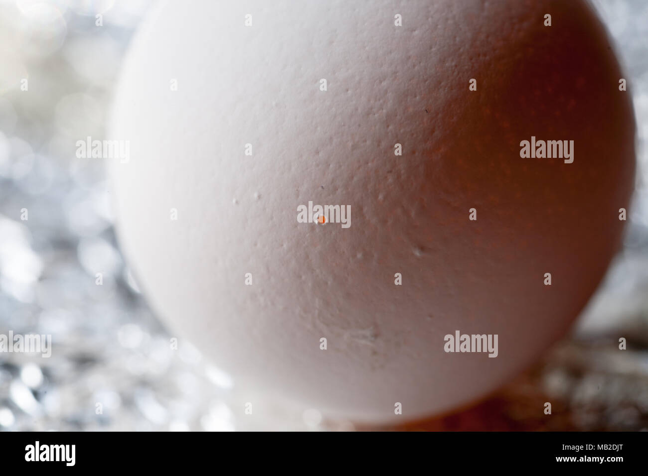 Small pin hole on the edge of egg shell for easy to peel Stock Photo ...