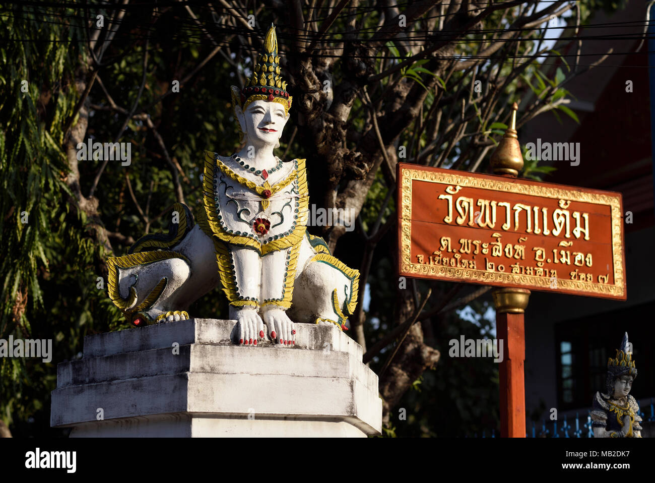 Buddhist statue and sign with Thai letters, Chiang Mai, Thailand Stock ...