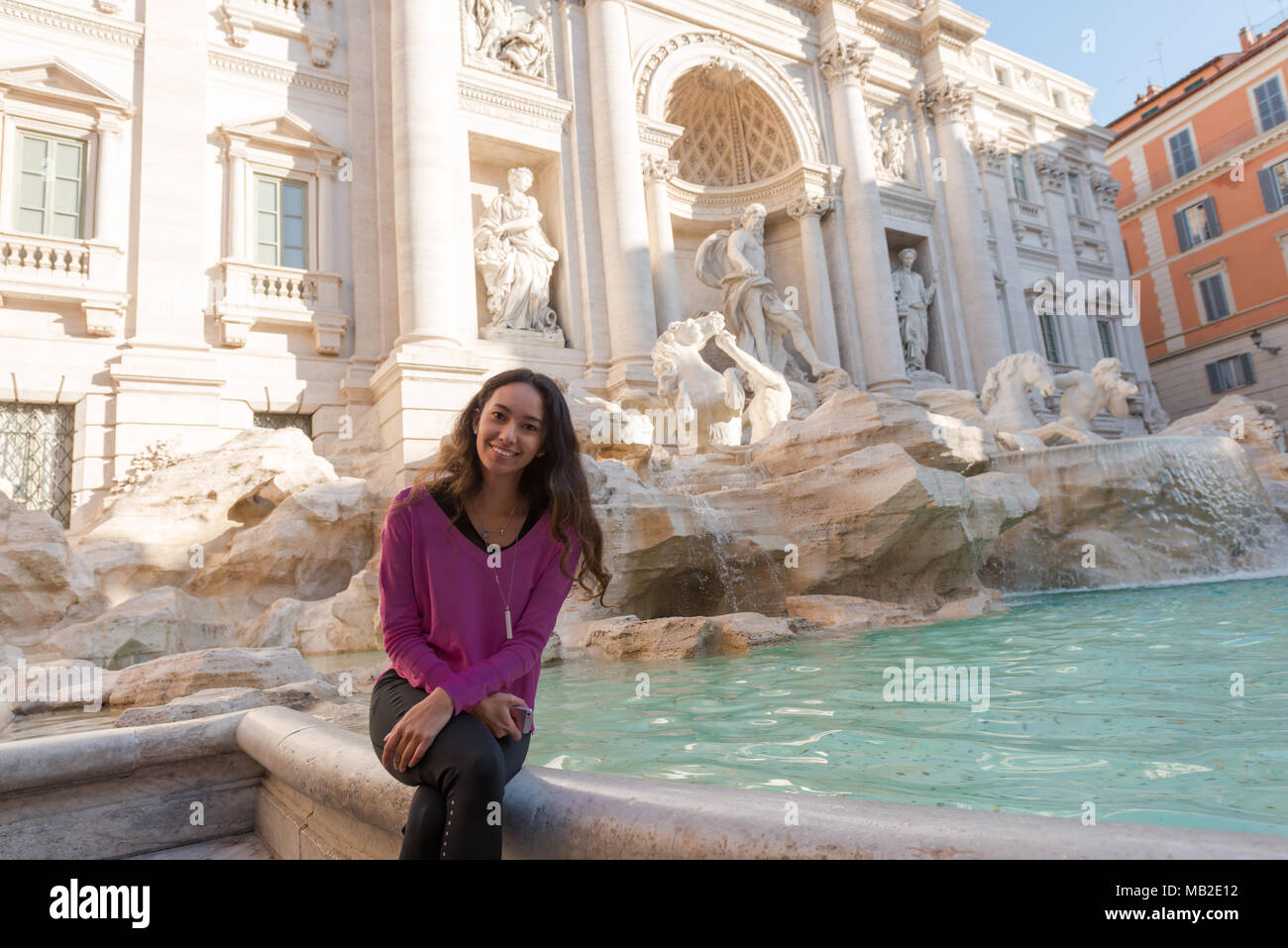 Horizontal picture of long and black hair woman posing in front of ...