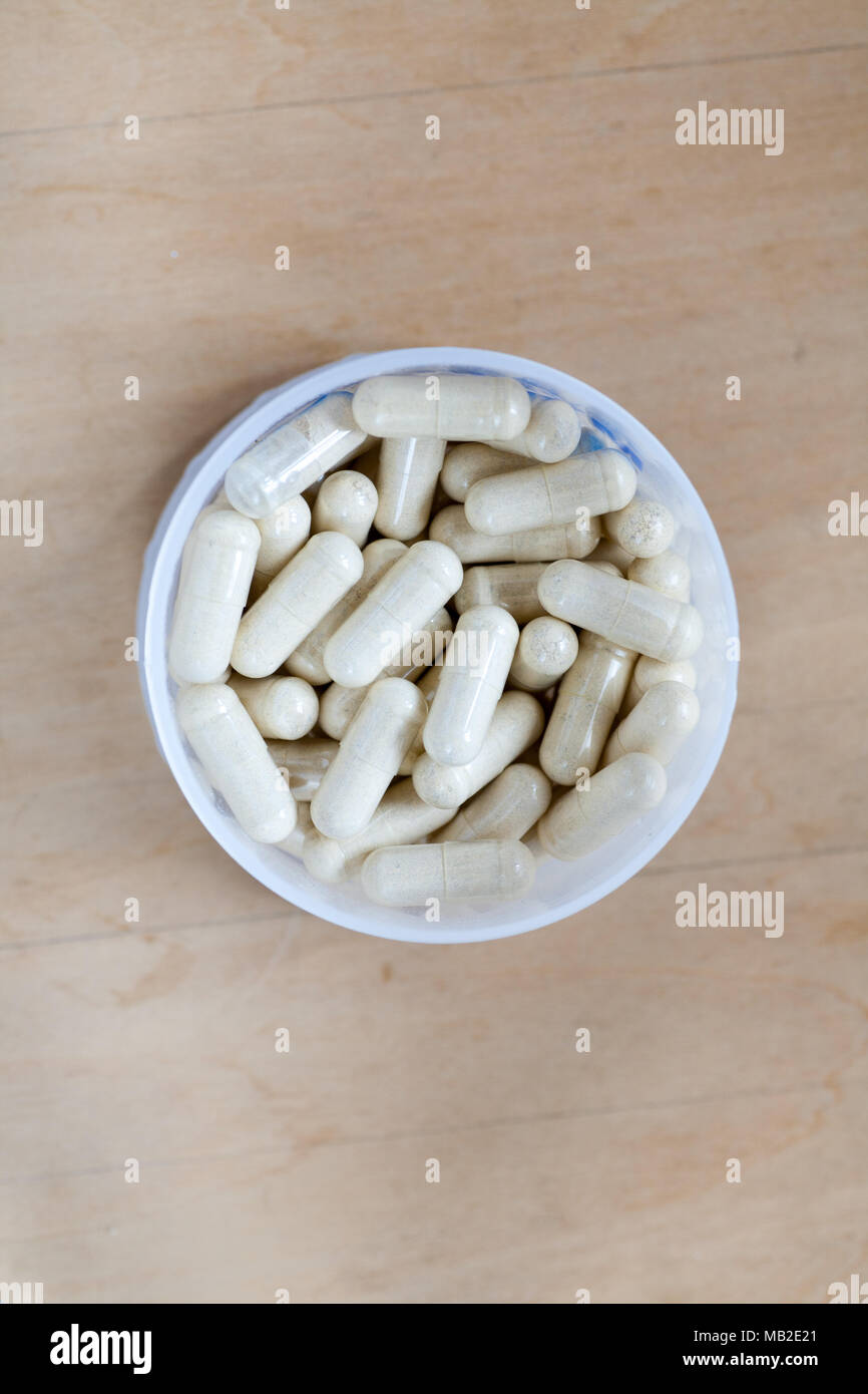 Multivitamin capsules in a bottle Stock Photo - Alamy