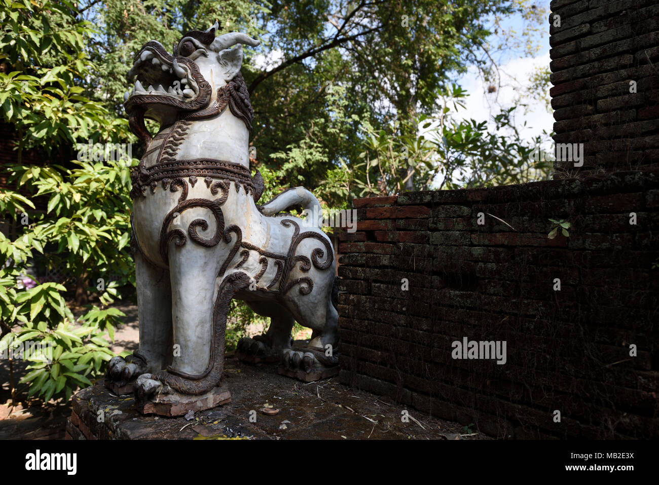 Singha lion statue at pagoda Chedi of temple Wat Lok Mori, Chiang Mai ...