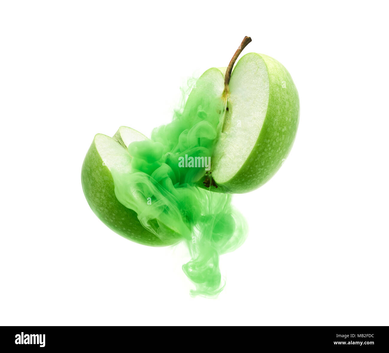 Green apple on ink isolated over white background Stock Photo - Alamy