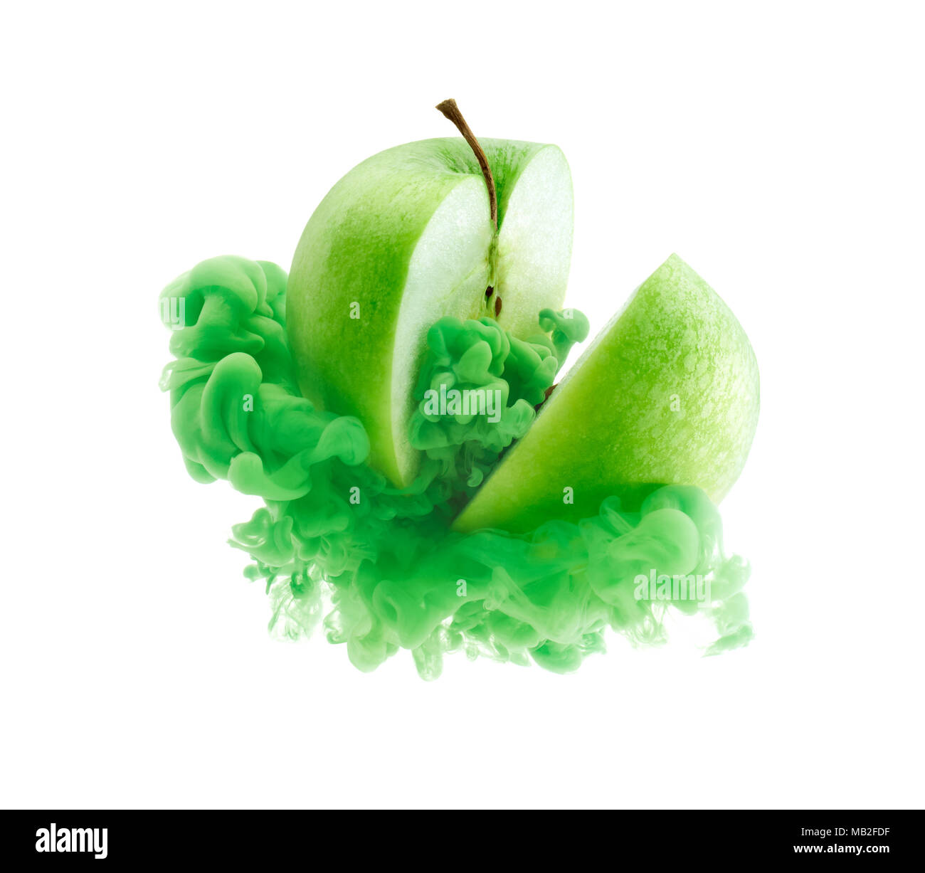 Green apple on ink isolated over white background Stock Photo - Alamy