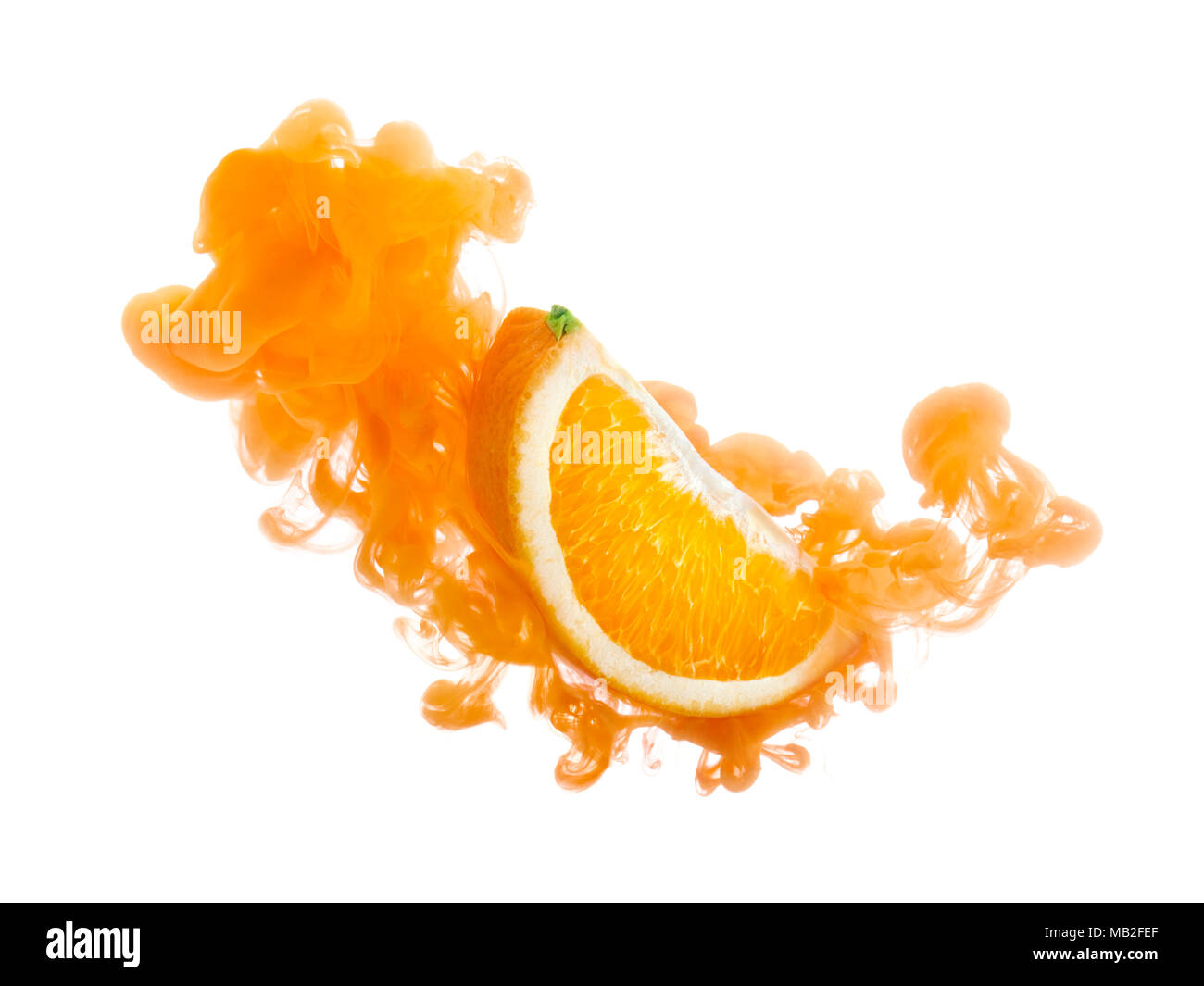 Orange fruit on ink isolated over white background Stock Photo - Alamy