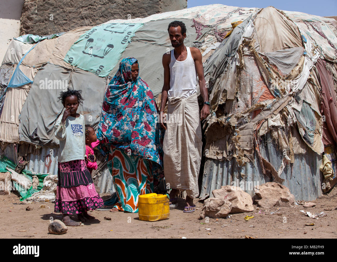 Somali family living in a slum hut made of corrugated iron and canvas ...