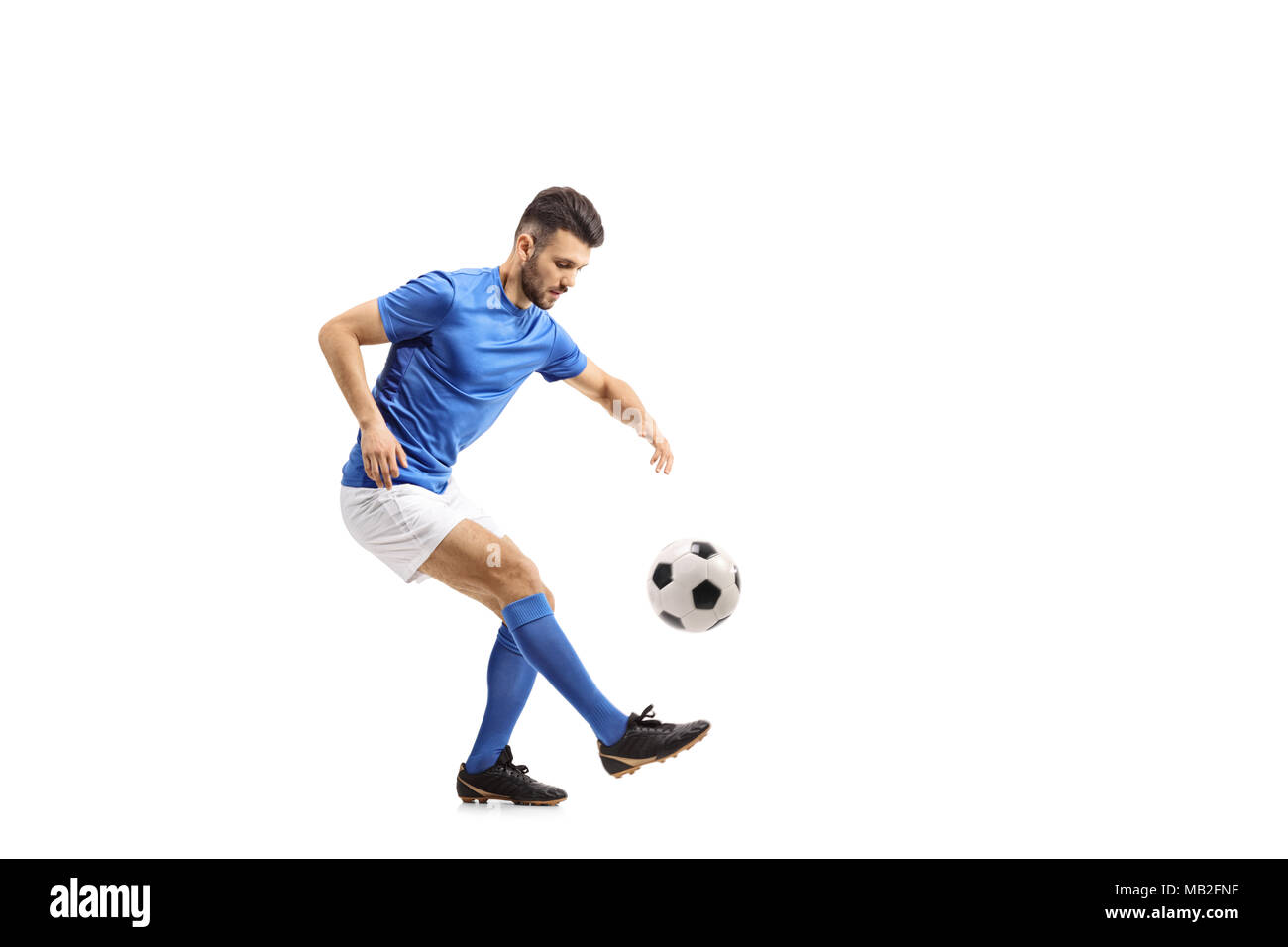 Soccer player juggling a football isolated on white background Stock ...