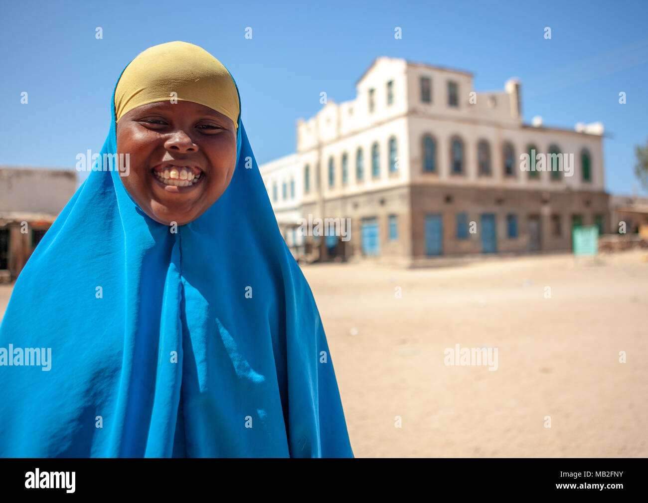 Smiling somali girl in front of a former ottoman empire house, North ...