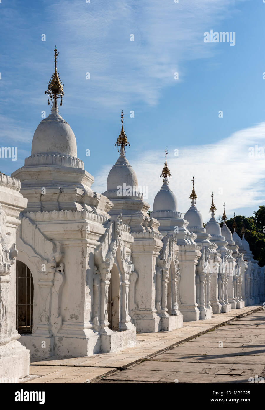 White kyauksa gu cave stupas at Kuthodaw Pagoda, Mandalay, Burma ...