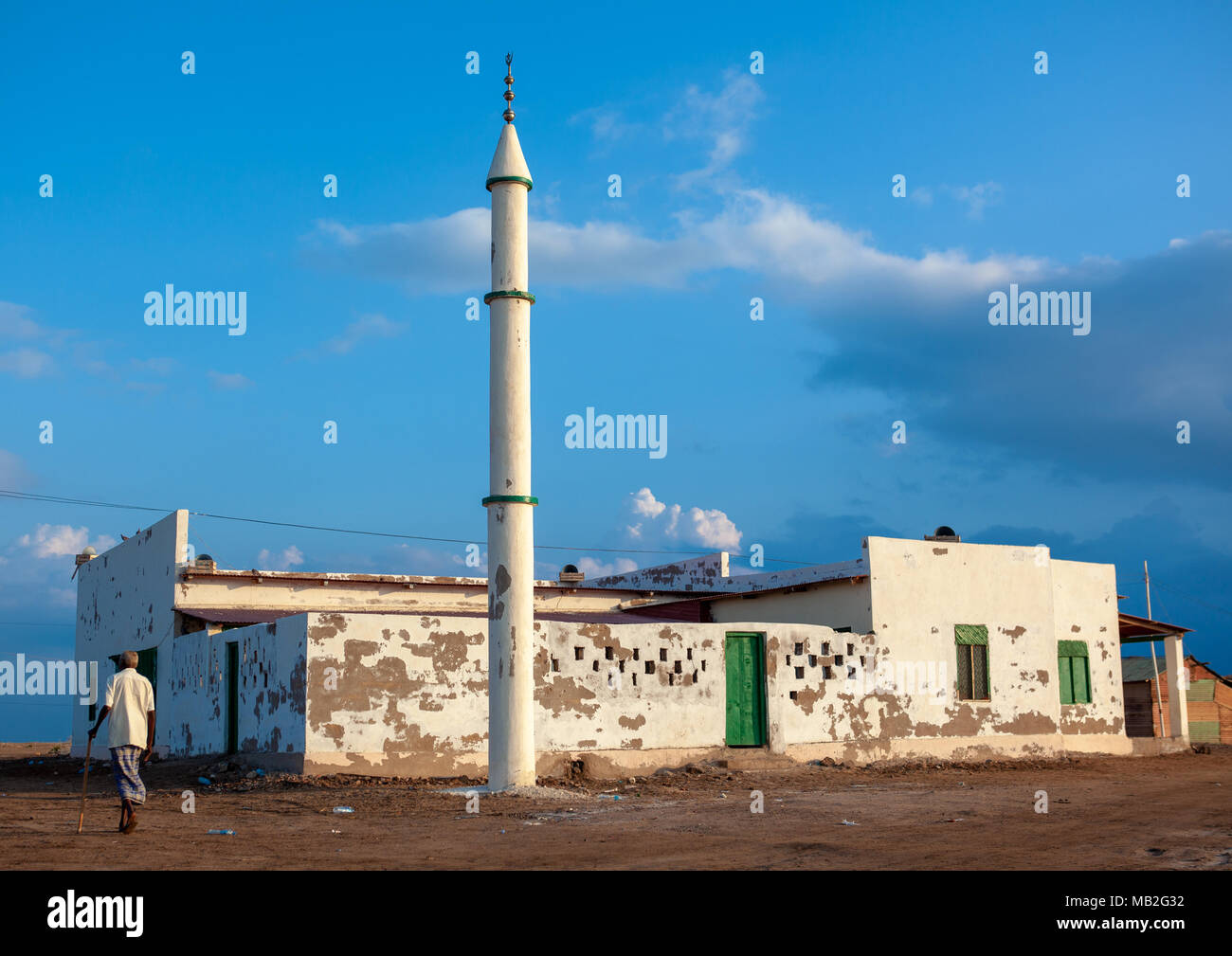 Somali man with in front of a mosque, Awdal region, Zeila, Somaliland ...